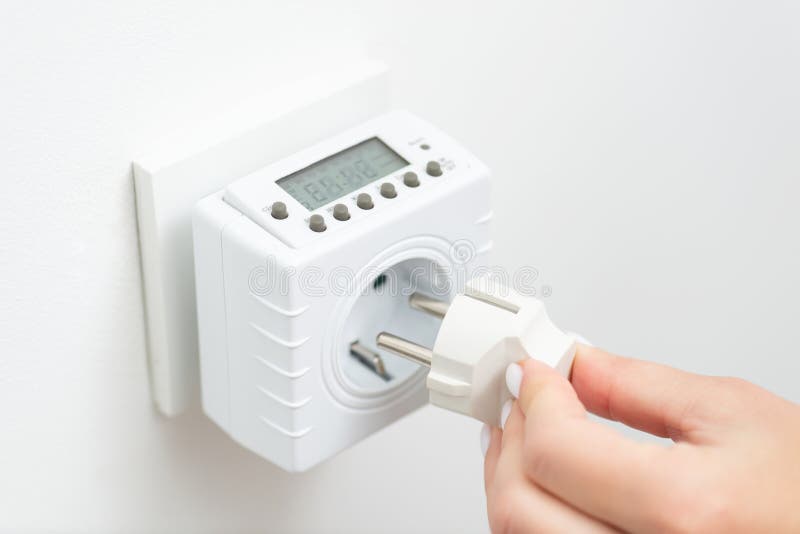 Close Up of Woman Hand Inserting Plug To the Socket Timer, Computer ...