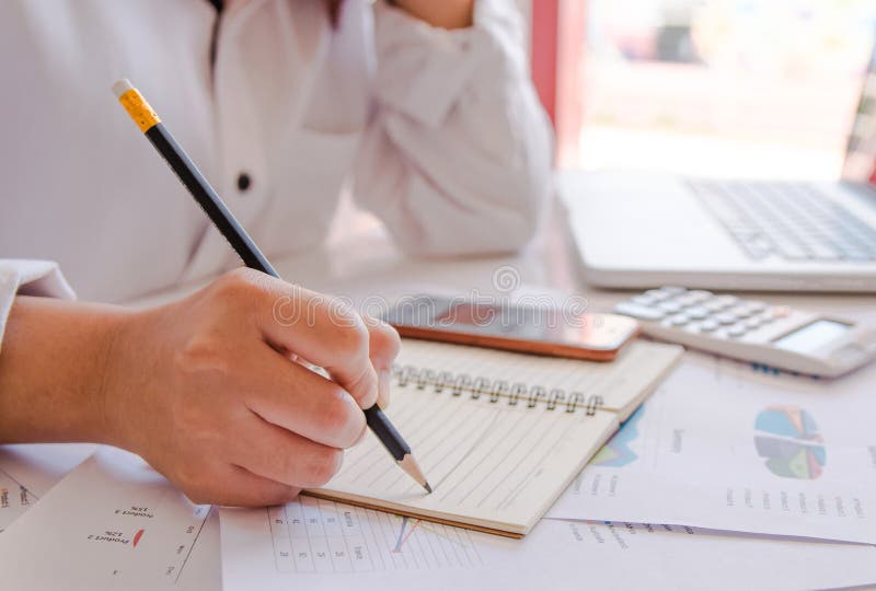 Close Up Woman Hand Using Calculator and Writing Make Note with Stock ...