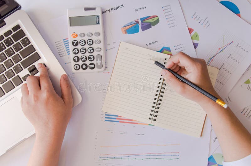 Close Up Woman Hand Using Calculator and Writing Make Note with Stock ...