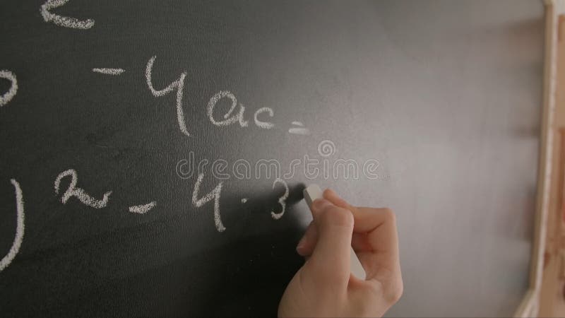 Close Up of Woman Hand Writing Examples and Formulas on Chalkboard ...