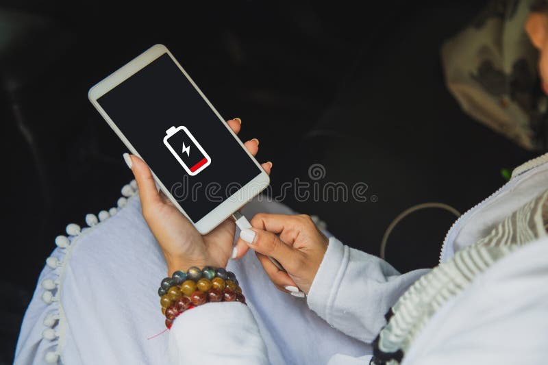 Close Up a Woman Hands Charging Her Mobile Phone with Charging Icon ...