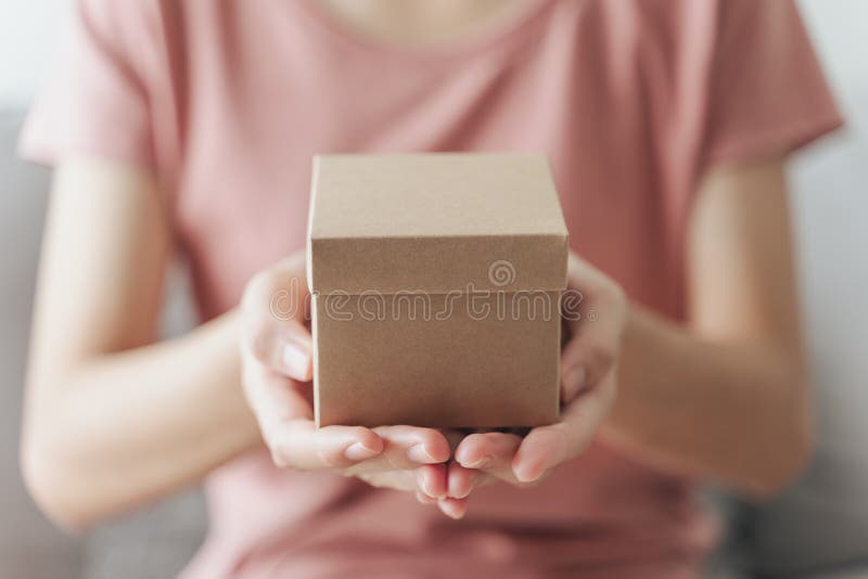 Close Up of Woman Hands Holding a Small Gift Box. Small Present Box in ...