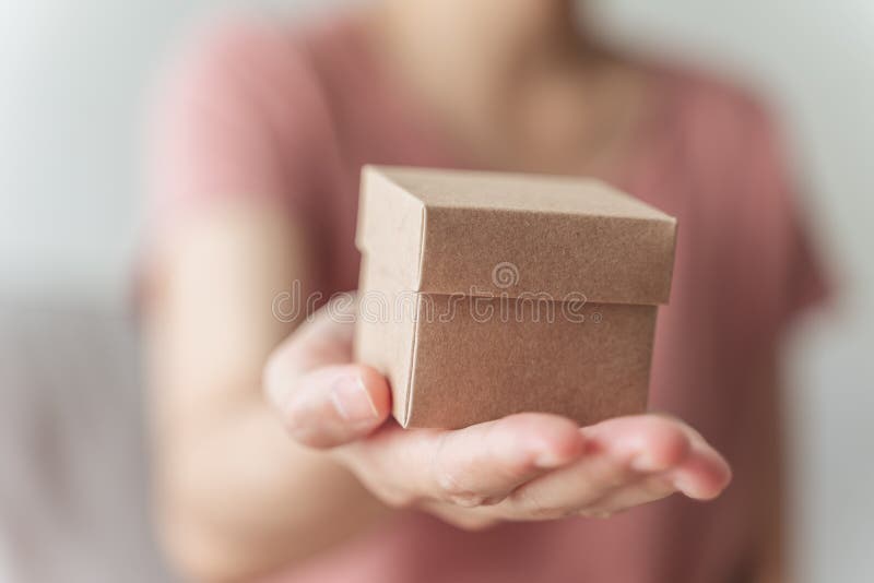 Close Up of Woman Hands Holding a Small Gift Box. Small Present Box in ...