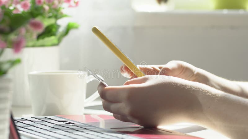 Close Up Woman Hands Using Smartphone and Computer Laptop at Workplace ...