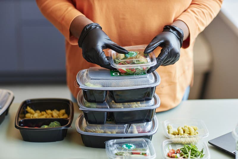 Close Up of Woman Holding Stack of Containers Packing Food Delivery ...