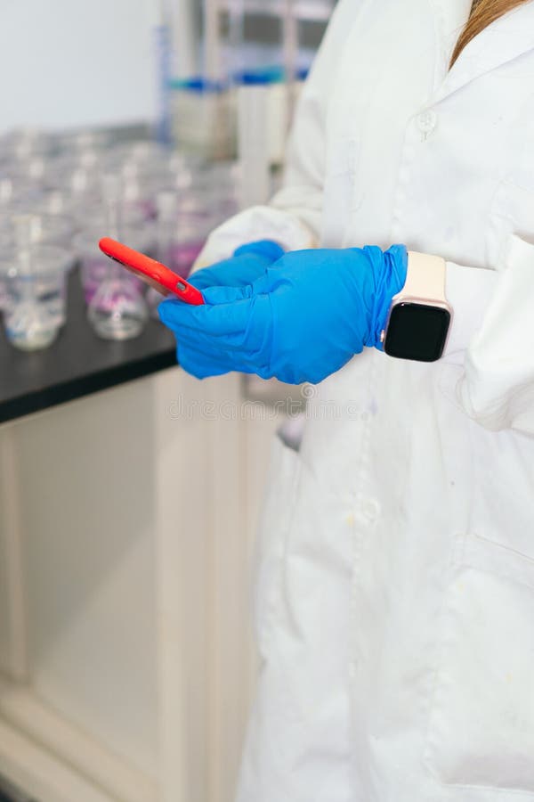 Close-up of Woman in Lab Coat Using Phone in Lab Stock Image - Image of ...