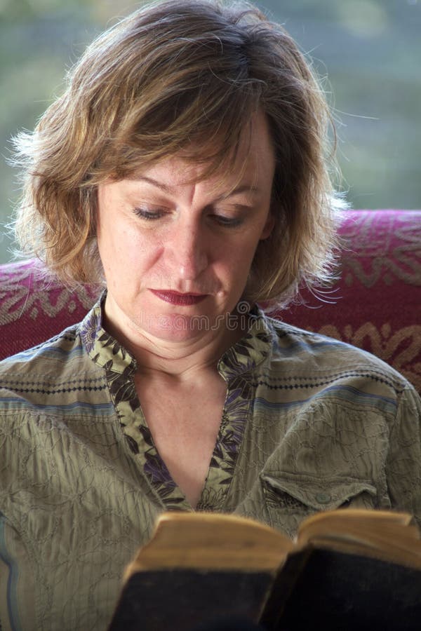 Close Up of Woman Reading Book with Back Lighting Stock Photo - Image ...