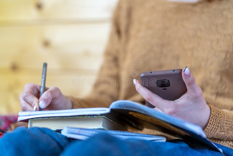 Close Up of a Woman S Hand Holding a Mobile Smartphone and Using a Pen ...