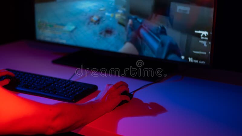 Close-up of a Woman S Hand Playing a Computer Game in Neon Light in the ...