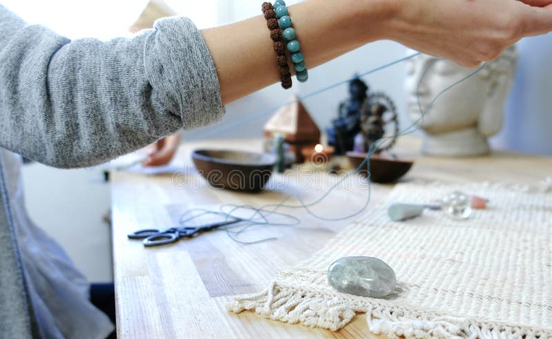 Weaving of Beads. Close-up of a Woman`s Hands Stringing Beads on the ...