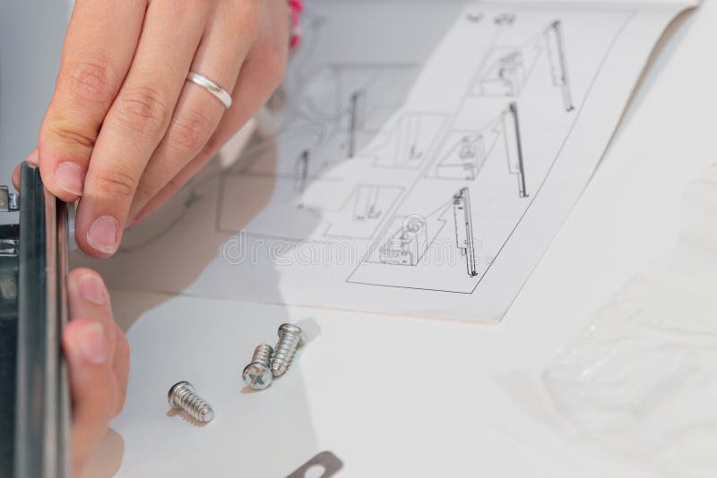 Close-up of a Woman& X27;s Hands Assembling a Metal Part while ...