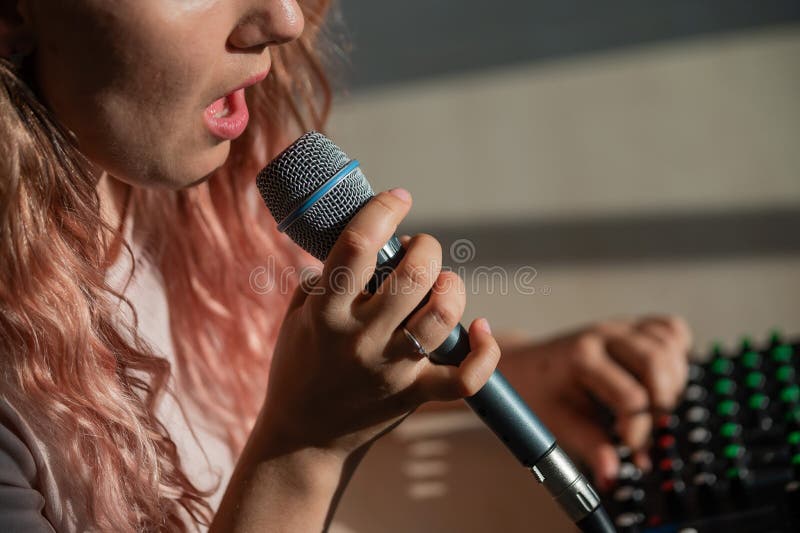 Close-up of a Woman Singing into a Microphone. Stock Image - Image of ...