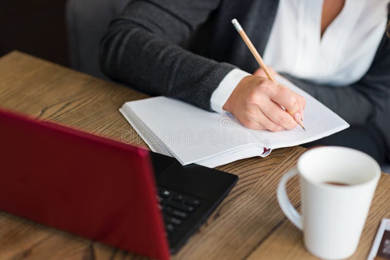 Close Up of Woman Taking Notes with Pencil Stock Photo - Image of ...