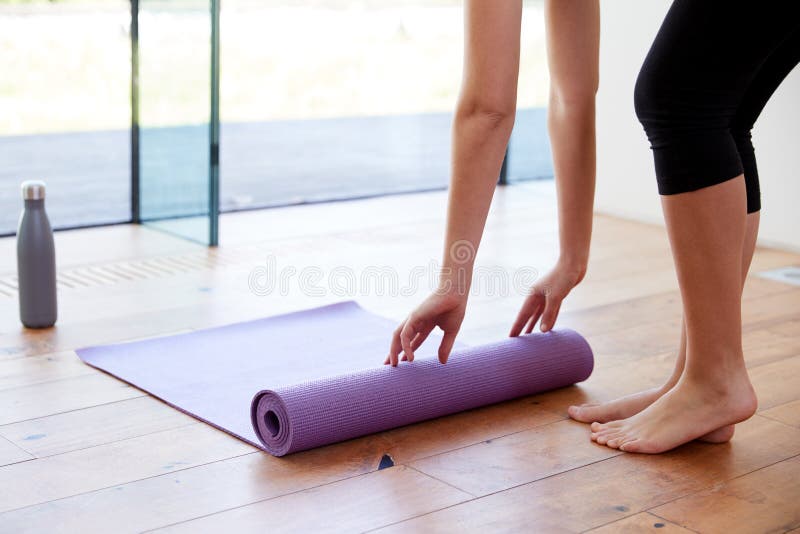 Close Up of Woman Unrolling Yoga Mat before Exercise Stock Image ...