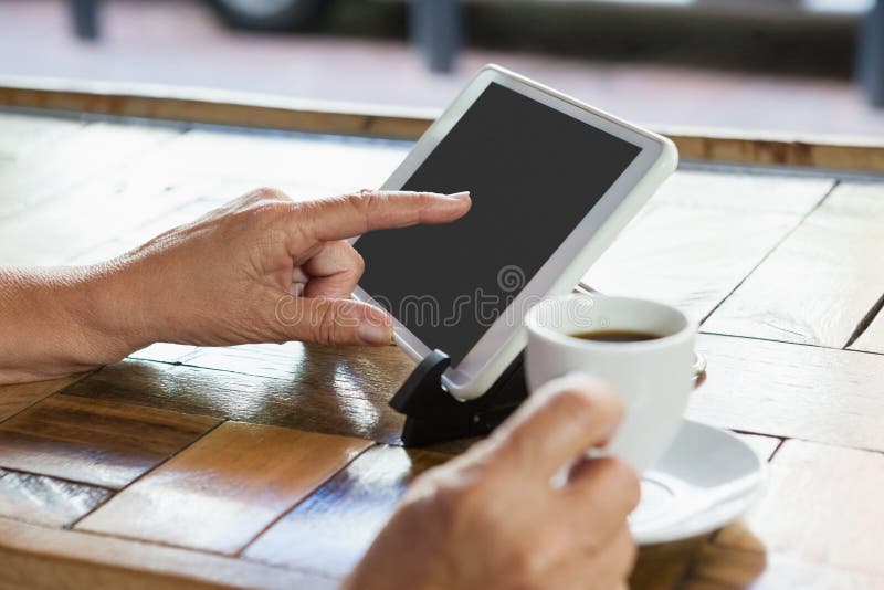 Close Up of Woman Using Tablet while Drinking Coffee Stock Photo ...