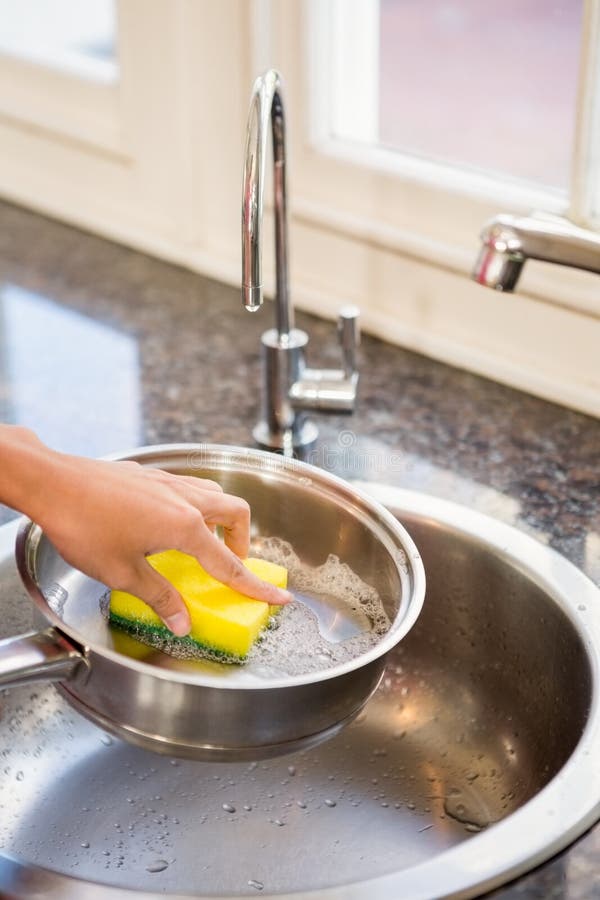 Woman washing the dishes stock photo. Image of cloth - 31098848