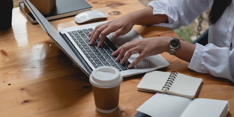Close Up of a Woman Working or Learning and Typing on Laptop Computer ...
