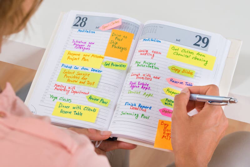 Woman Making List of Office Work in Diary Stock Image - Image of ...