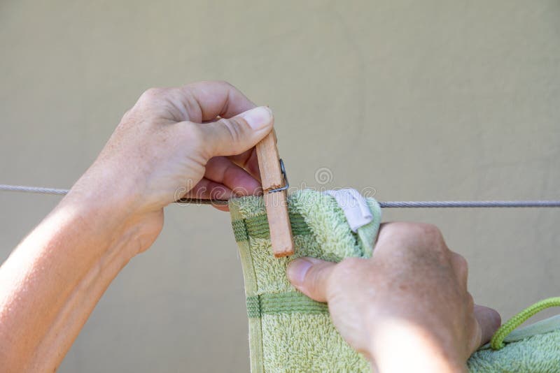 Close-up of Womans Hands Hanging Up Washed Clothes Stock Photo - Image ...