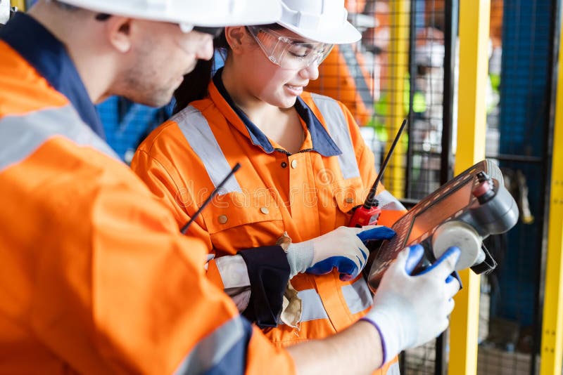 Close Up Woman Engineer Using Remote Robot Controller Operate Standing ...