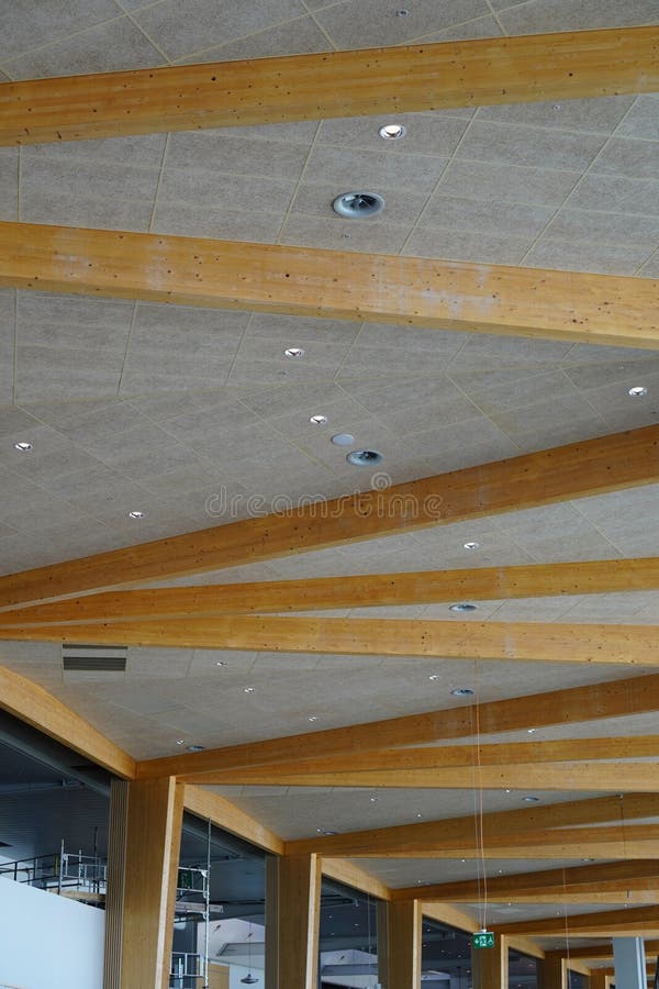 Close Up of Wooden Beams on the Ceiling. Lighting and Ventilation Spots ...