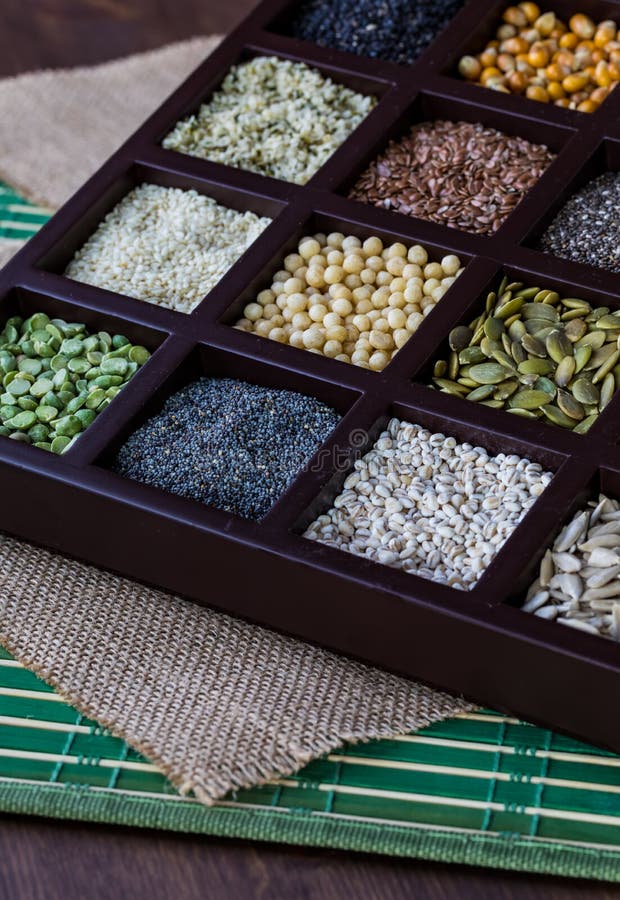 A Close Up of a Wooden Box Filled with Compartments of Seeds and Grains ...