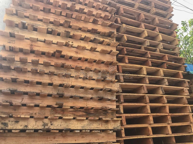 Wooden Pallets Stacked in a Warehouse Stock Photo - Image of board ...