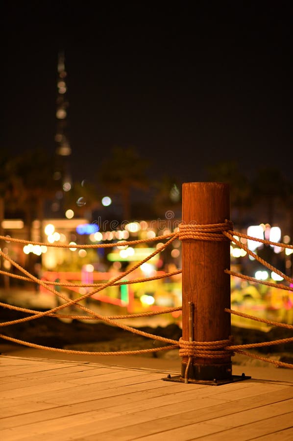 Close Up of Wooden Pier and City Lights Stock Photo - Image of glowing ...