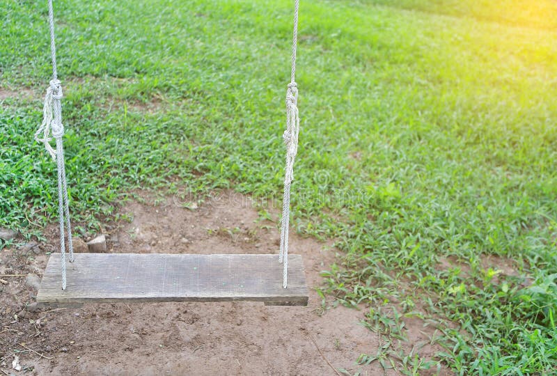 Close Up Wooden Swing in Garden with Sunset Background Stock Image ...
