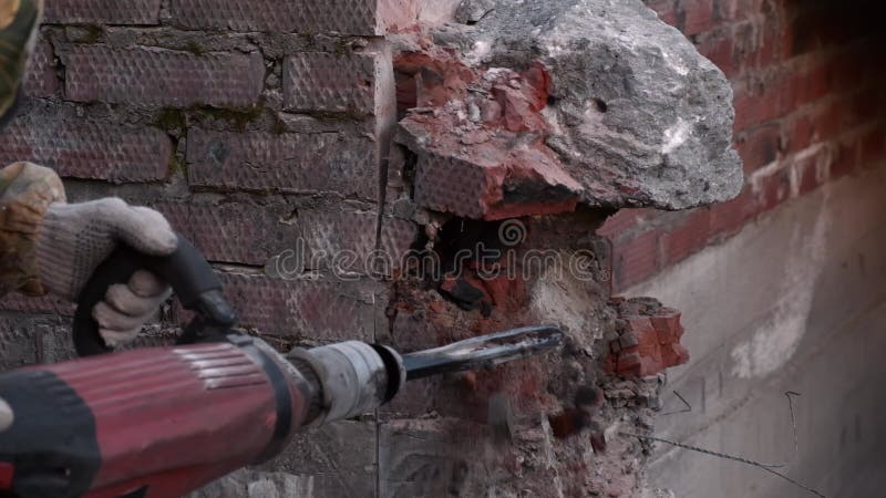 Close-up. Worker Breaks the Wall with a Perforator. Slow Motion. Stock ...