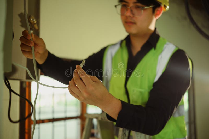 Close Up of Worker Connecting LAN Cable during a Renovation Project ...