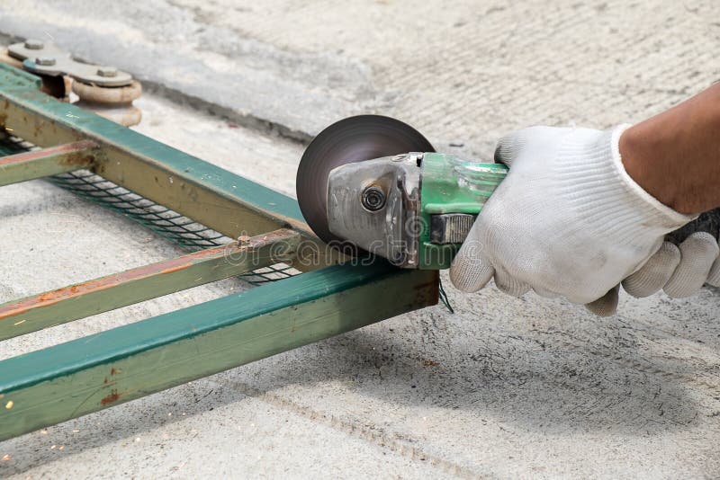 Worker Cutting Metal with Grinder Stock Photo - Image of grinder, hand ...