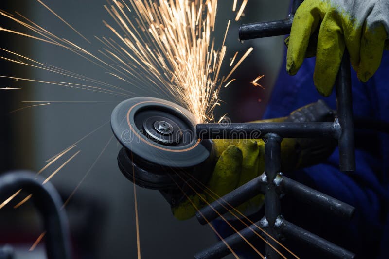 Close Up of Worker Hands Grinding a Piece of Welded Pipe Stock Photo ...
