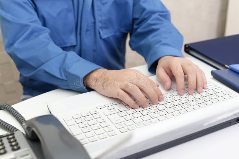 Worker using a laptop stock image. Image of isolated - 127073217