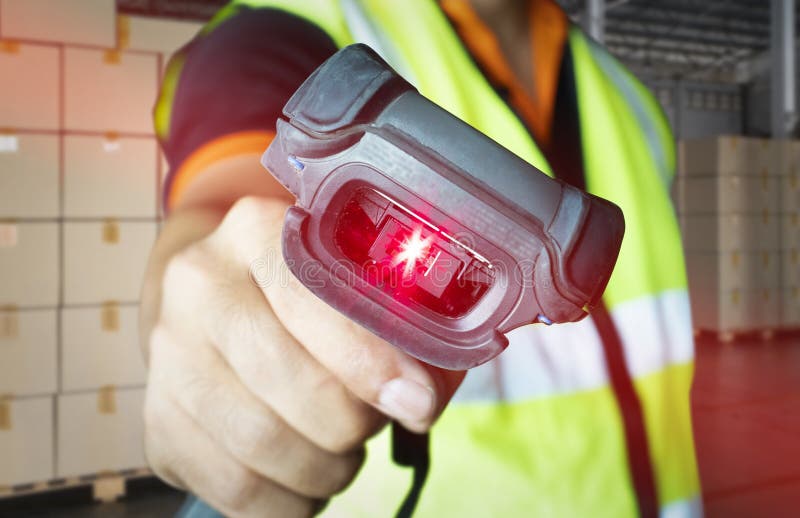 Close-up Worker Scanning Barcode Scanner with Red Laser. Computer ...
