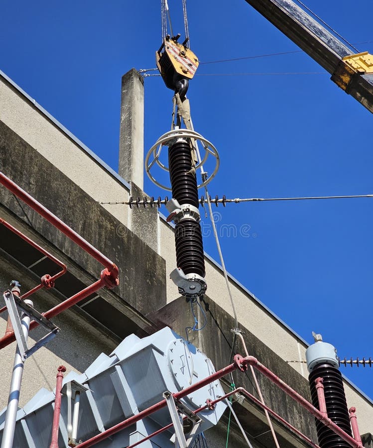 A Close-up of a Worker Using a Crane To Install a Large, Ceramic ...