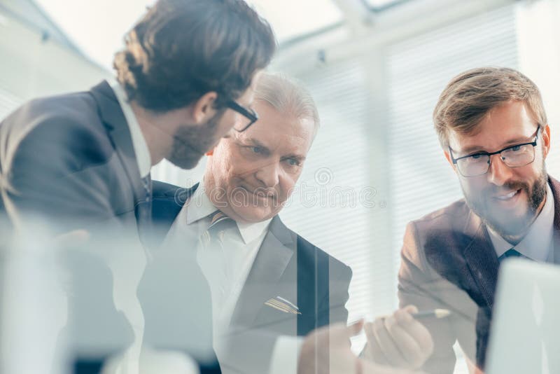 Close Up. Working Group Looking at the Monitors of Office Computers ...