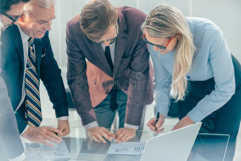 Close Up. Working Group Looking at the Monitors of Office Computers ...