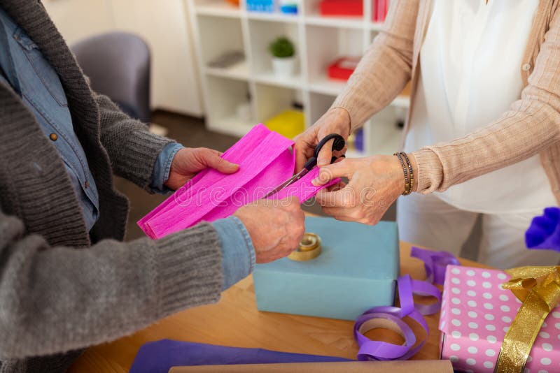 Close Up of a Wrapping Paper Being Cut Stock Photo - Image of together ...