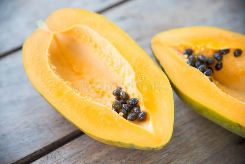 Yellow Papaya Fruit on Wood Table. Stock Photo - Image of organic ...