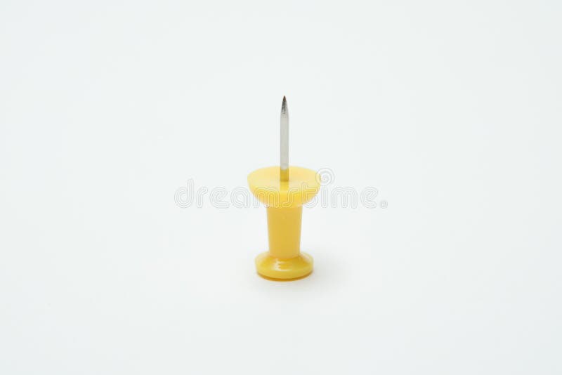 Close Up of Yellow Pin on White Background Stock Photo - Image of hang ...