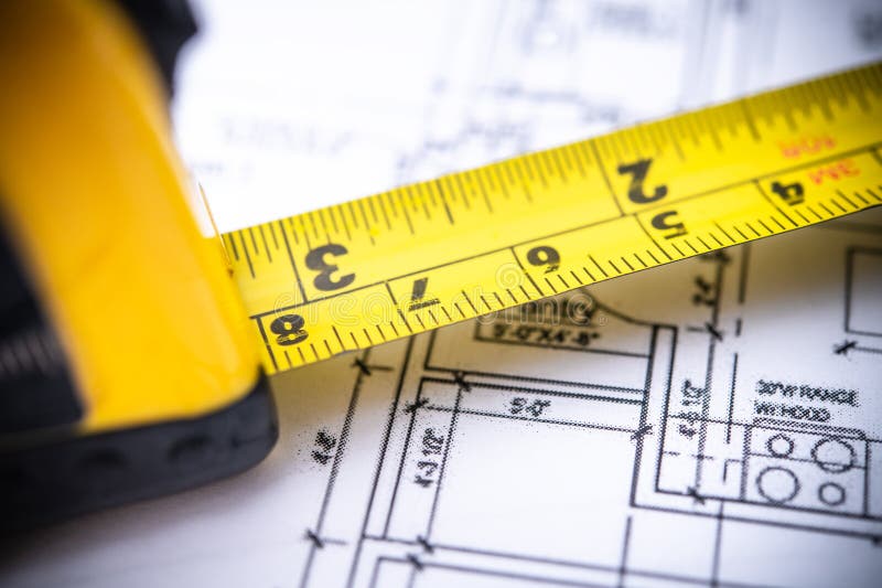 Close-Up of Yellow Tape Measure on Architectural Blueprint for ...