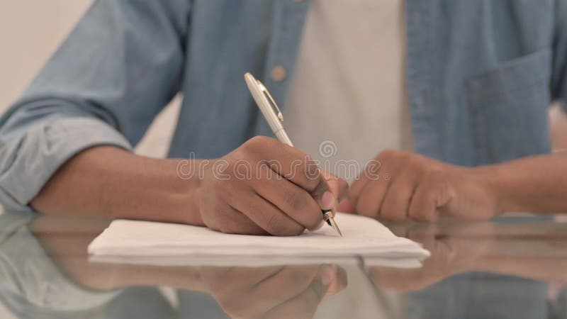 Close Up of Young African Man Writing a Letter Stock Footage - Video of ...