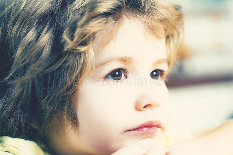 A Close Up of a Young Boy with a Serious Look of Concern. Stock Image ...