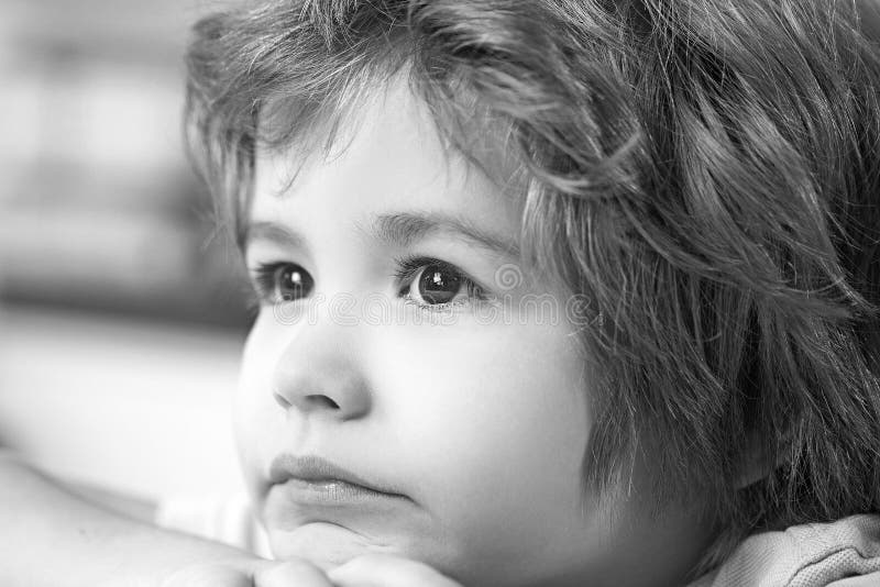 A Close Up of a Young Boy with a Serious Look of Concern. Stock Photo ...