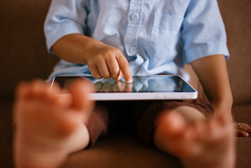 Close-Up of Young Boy Using Tablet Computer Stock Photo - Image of ...
