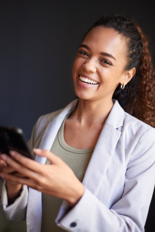 A Close Up of a Young Business Woman Typing on Her Smartphone and ... A Close Up of a Young Business Woman Typing on Her Smartphone and ...