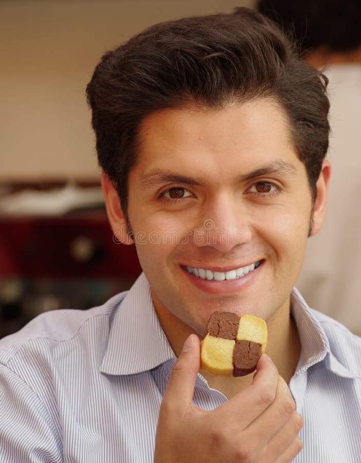 Close Up of a Young Businessman Eating Cookie Stock Image - Image of ...