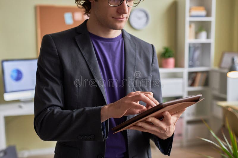 Close Up of Young Businessman Using Digital Tablet Standing in Office ...