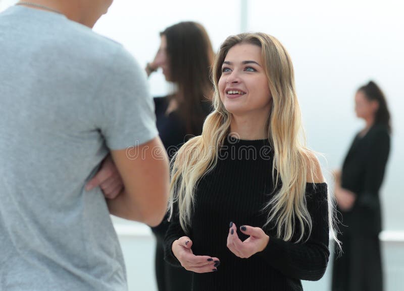 Close Up. Young Colleagues Talk Standing in the Office Stock Photo ...